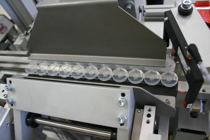 Flip Top Caps Closing System Case Study | RNA Automation