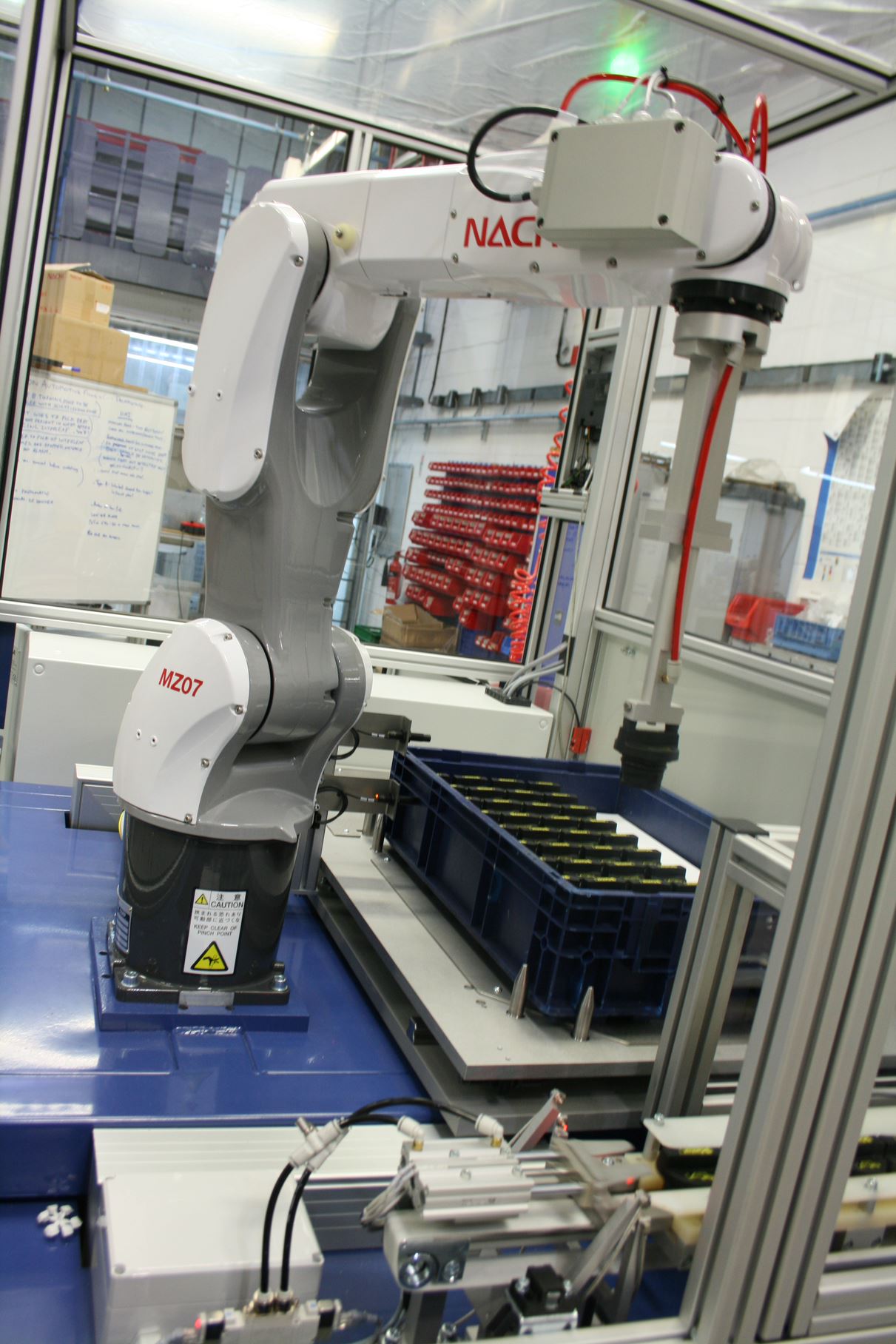 Robotic Packaging System Packs Filler Caps | RNA Automation