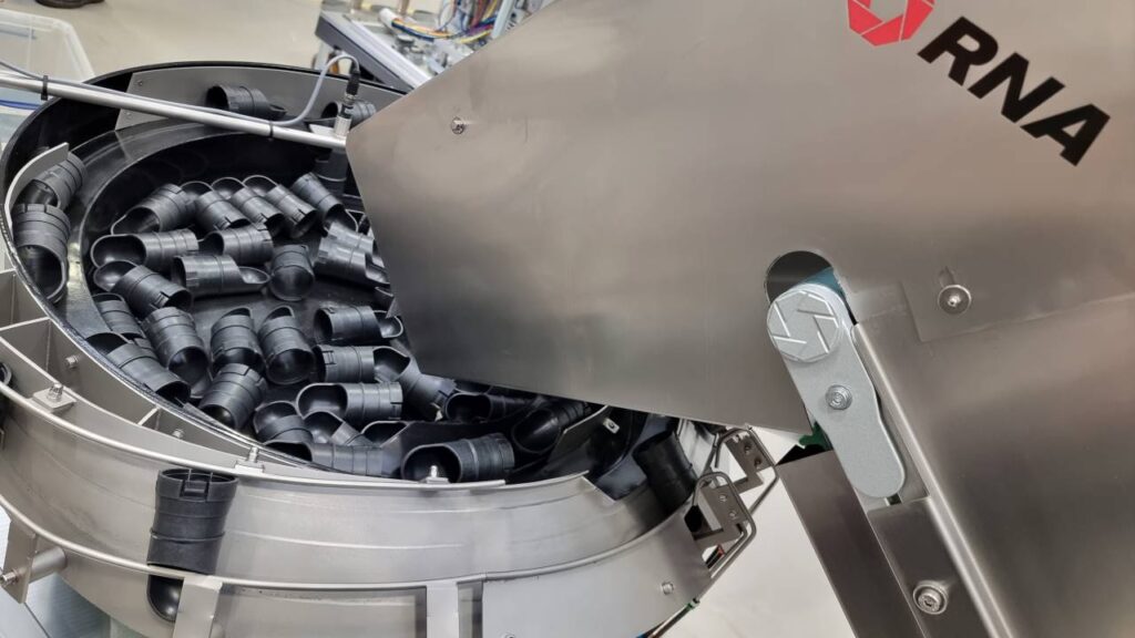Bowl feeder to feed and orientate Bag Connectors - RNA Automation