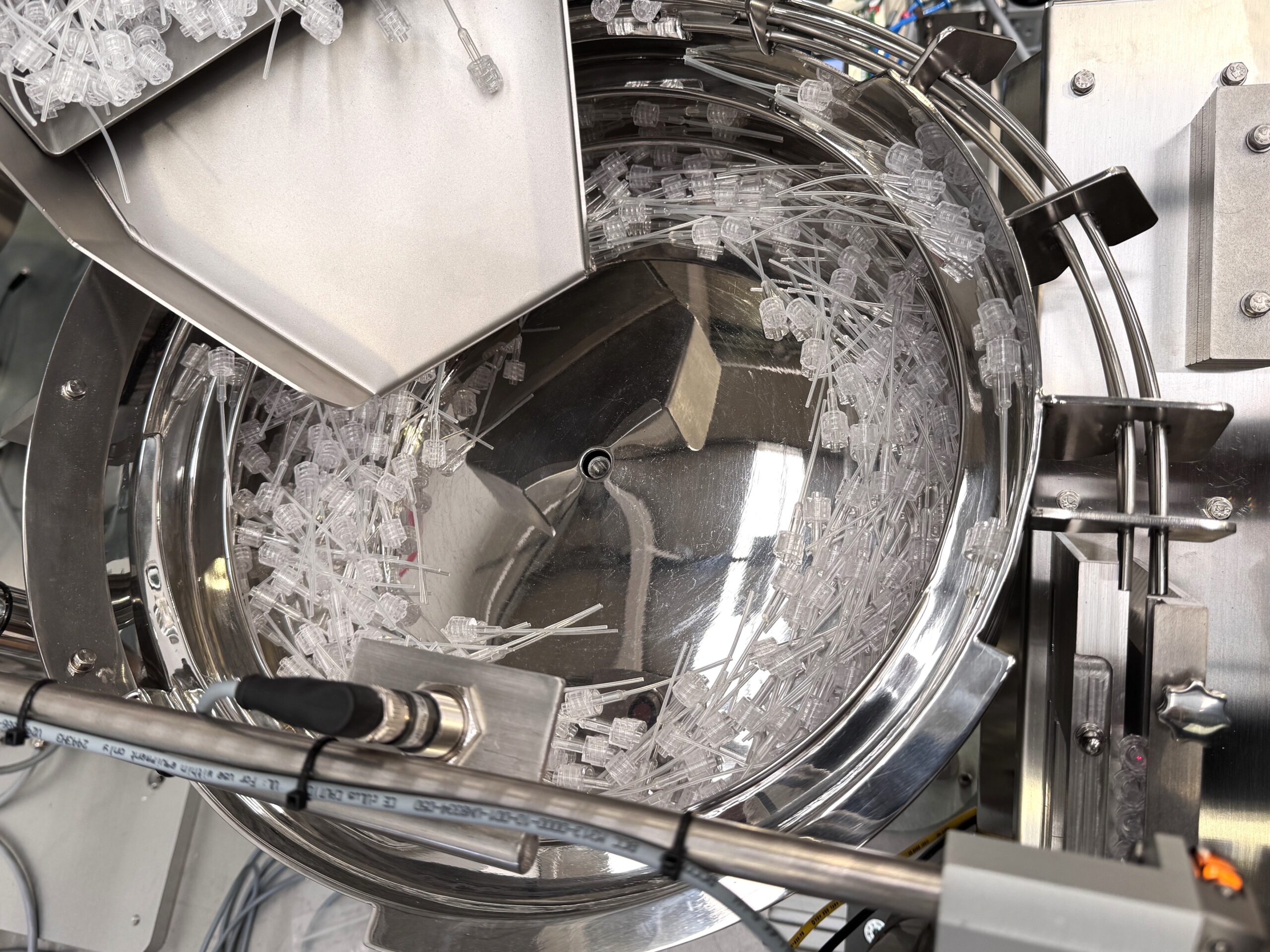 Bowl Feeders to feed and orientate Luer Lock with Tube - RNA Automation